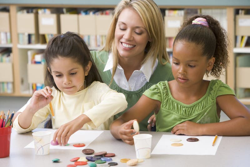Teacher Sitting with Students in Art Class Stock Photo - Image of class ...