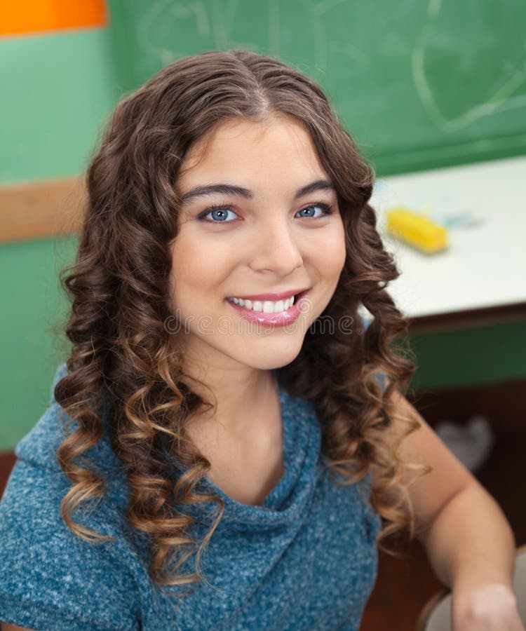 Teacher Smiling in Classroom Stock Photo - Image of cute, hair: 33270414