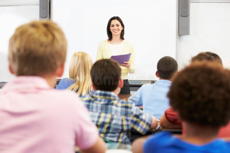 Teacher Standing in Front of Class of Pupils Stock Photo - Image of ...