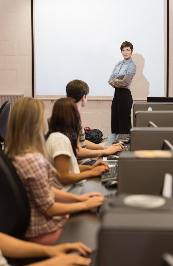 Teacher Standing in Front of Projection Screen Stock Photo - Image of ...