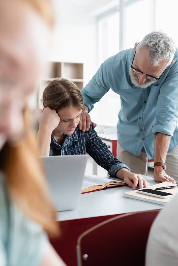 Teacher Standing Near Sad Schoolboy in Stock Photo - Image of ... Teacher Standing Near Sad Schoolboy in Stock Photo - Image of ...