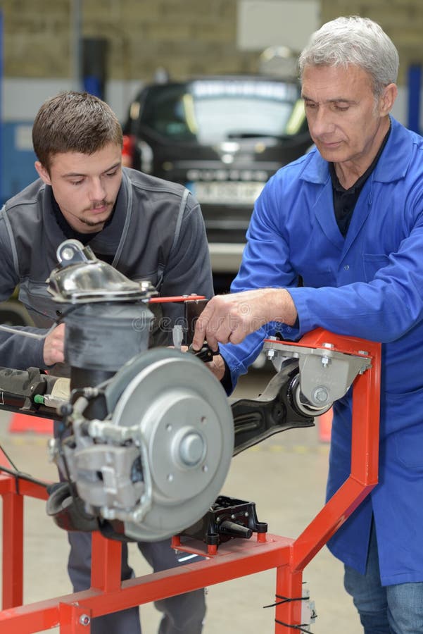 Teacher and Student in Auto Mechanics Training Class Stock Photo ...