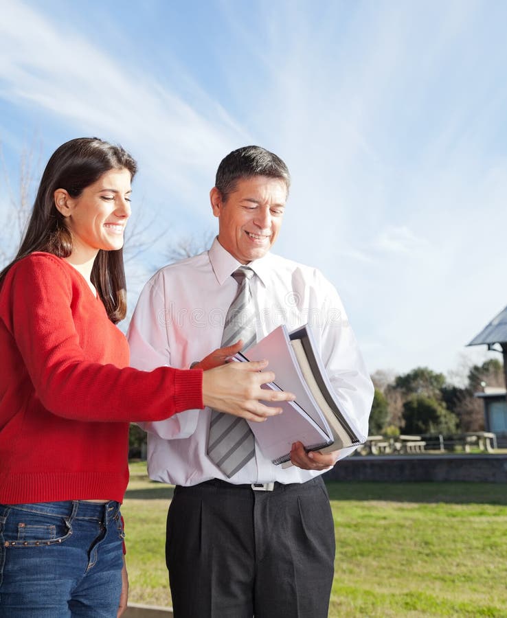 Teacher and Student with Books Standing on Campus Stock Image - Image ...