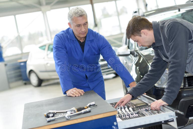 Teacher and Student Choosing Appropriate Tools in Mechanic School Stock ...