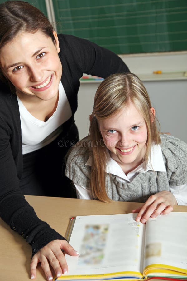 Teacher Helping Student One on One Stock Photo - Image of school ...