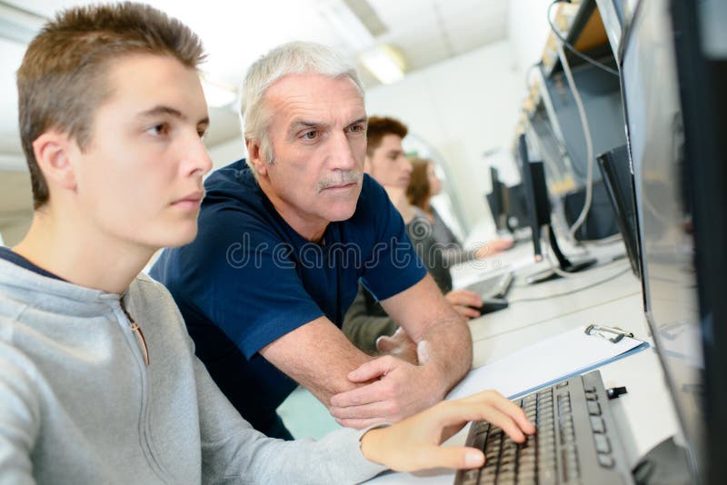 Teacher and Student with Computer Stock Photo - Image of help ...