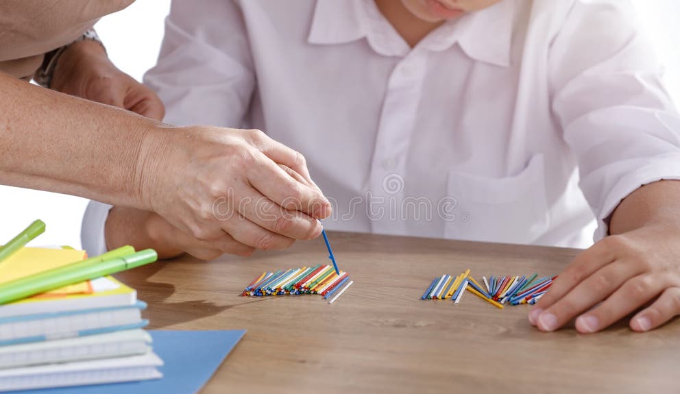 Teacher and Student Hands Counting Math Sticks during Math Class at ...