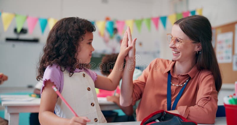 Teacher, Student and High Five in Classroom, School and Support with Mind Development at Academy ...