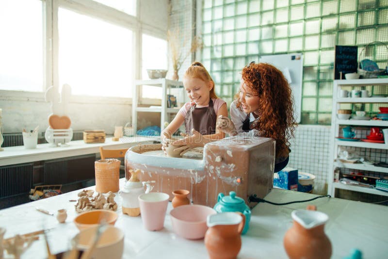 Teacher and Student Make Pitcher of Pottery Wheel Stock Image - Image ...