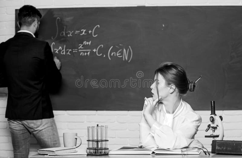 Solving Task. Man Writing on Chalkboard Math Formulas. Teaching in ...