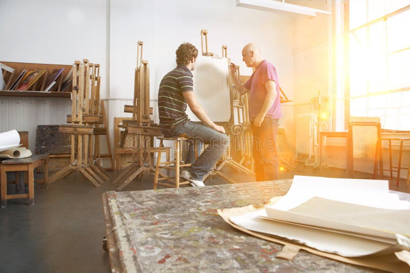 Teacher and Student Painting in Artist Studio Stock Photo - Image of ...