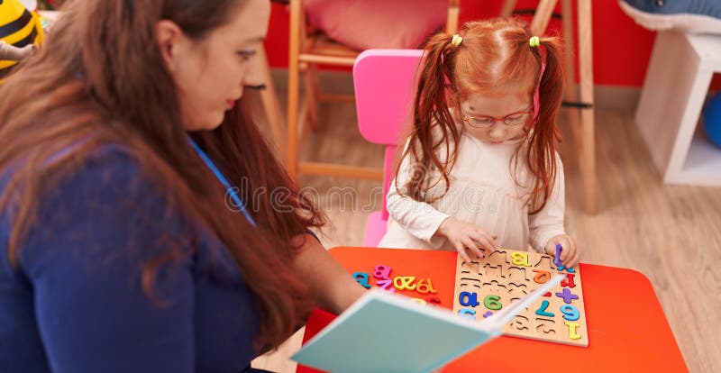Teacher and Student Playing with Maths Puzzle Game Reading Book at ...