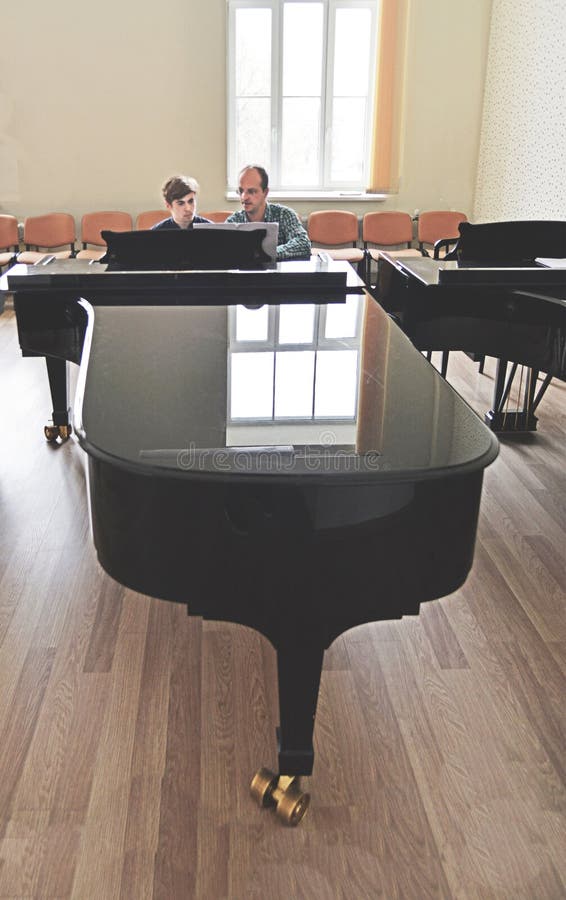 Teacher with Student Playing Piano Editorial Photography - Image of ...
