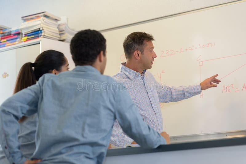 Teacher and Student Pointing To Board Stock Photo - Image of attention ...