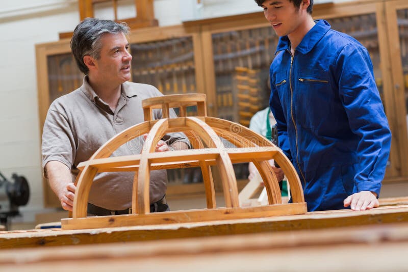 Teacher and Student Talking about a Wooden Frame Stock Photo - Image of ...