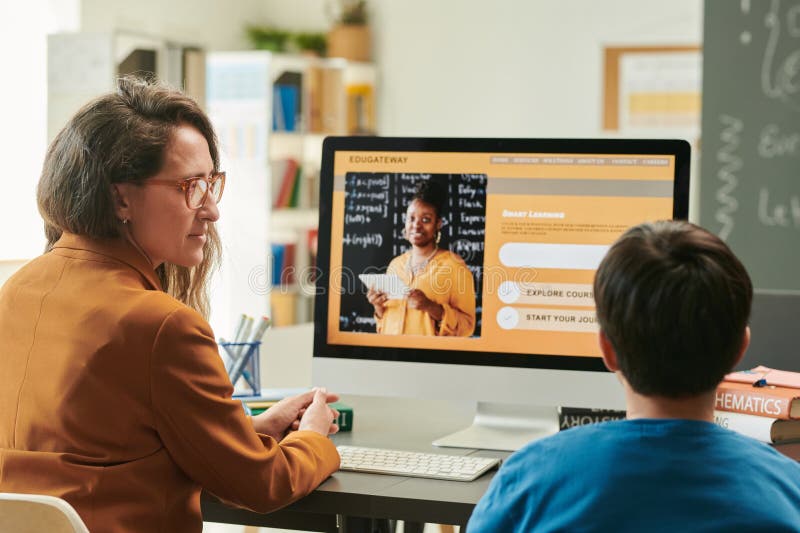 Teacher and Student Using Computer Stock Image - Image of computer ...