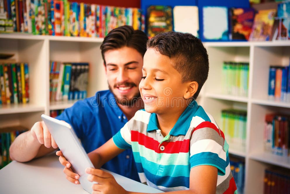 Teacher and Student Using Digital Tablet in Library Stock Photo - Image ...