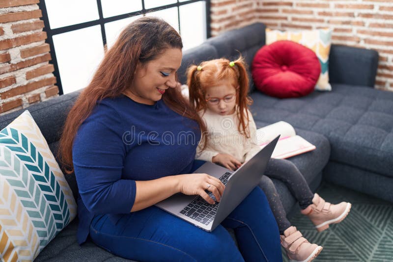 Teacher and Student Using Laptop Sitting on Sofa at Home Stock Photo ...