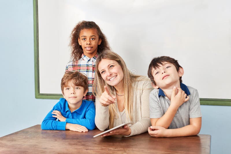 Teacher Using Tablet in Computer Science Class Stock Photo - Image of ...