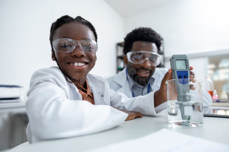Teacher and Student Working in a School Laboratory and Looking Involved ...