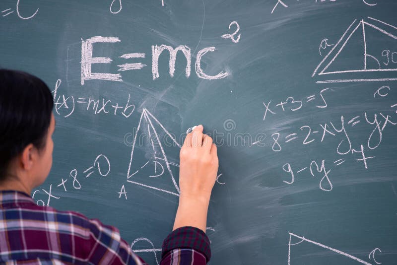 Teacher or Student Writing on Blackboard during Math Lesson in School ...