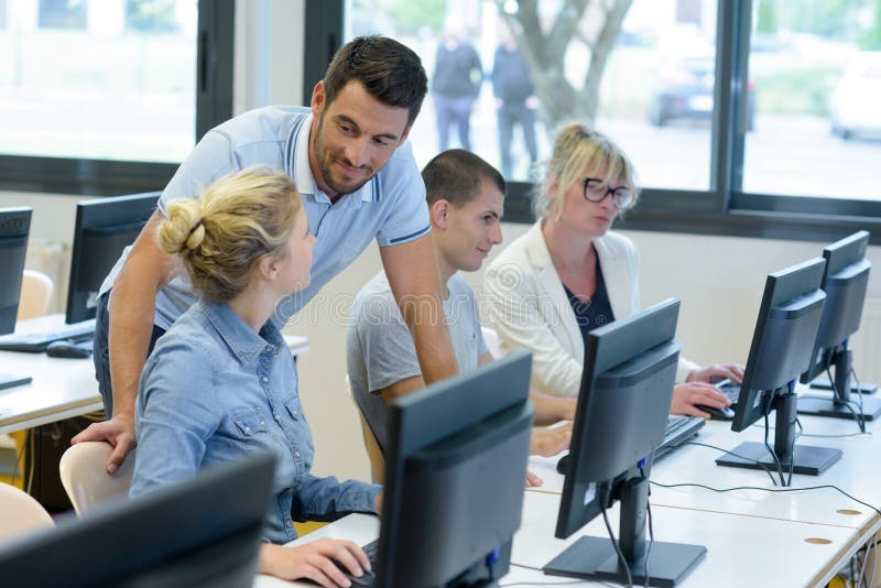 Teacher and Students in Classroom Stock Photo - Image of studying ...