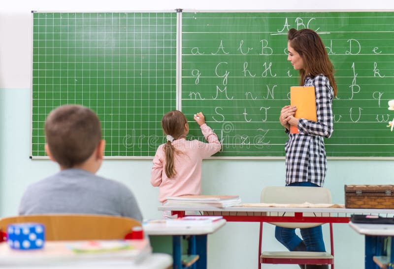 Teacher and Students in the Classroom: Teaching Stock Photo - Image of ...