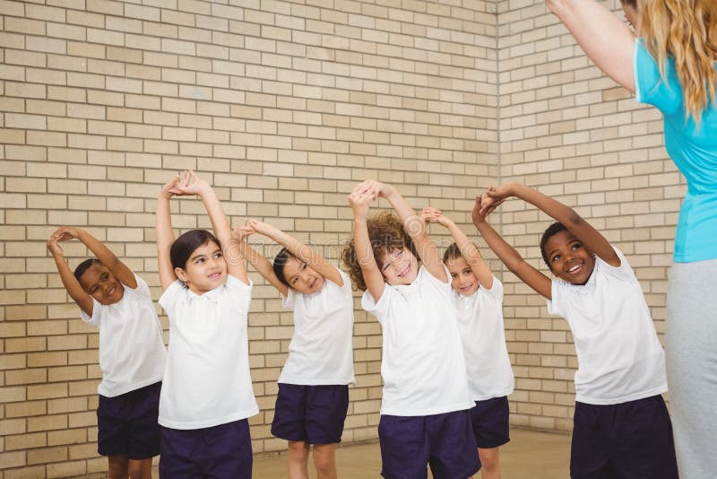 Teacher and Students Doing Stretches Stock Image - Image of female ...