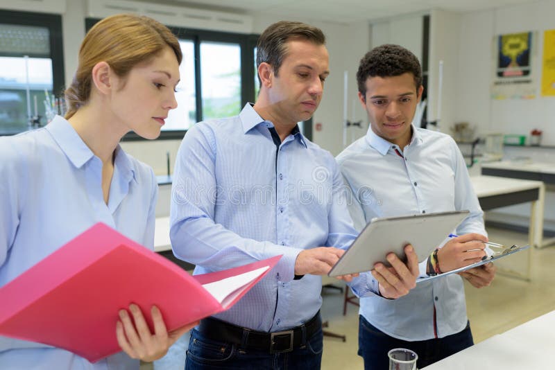 Teacher and Students Overseeing Science Experiment Stock Photo - Image ...