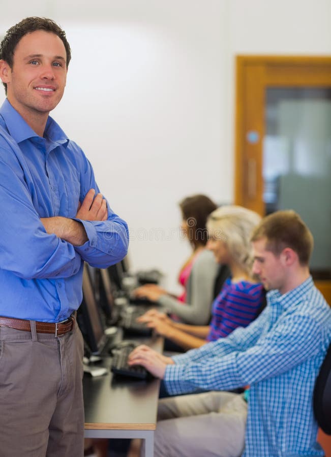 Teacher with Students Using Computers in Computer Room Stock Image ...