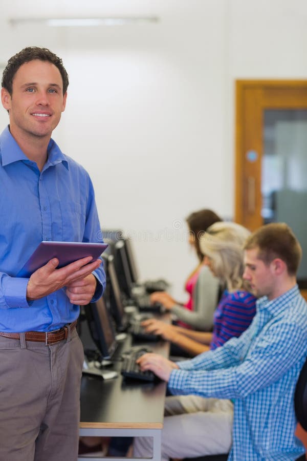 Teacher with Students Using Computers in Computer Room Stock Image ...
