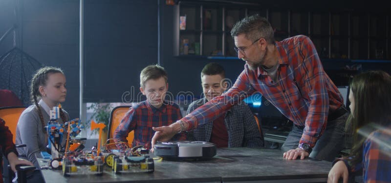 Teacher and Students Using 3D Printer Stock Photo - Image of boys ...