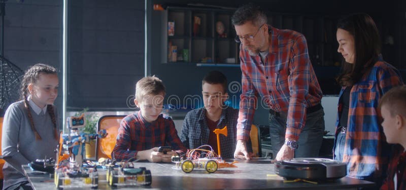 Teacher and Students Using 3D Printer Stock Photo - Image of indoors ...