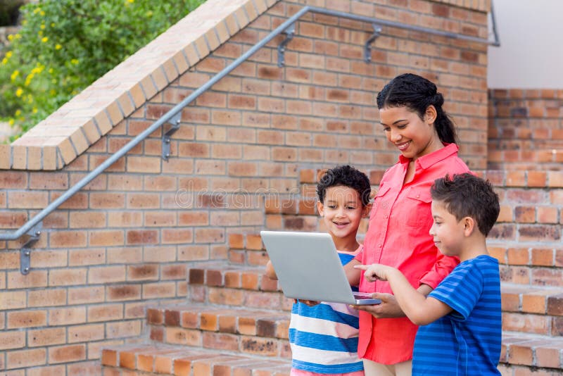 Teacher with Students Using Laptop by Steps Stock Photo - Image of ...