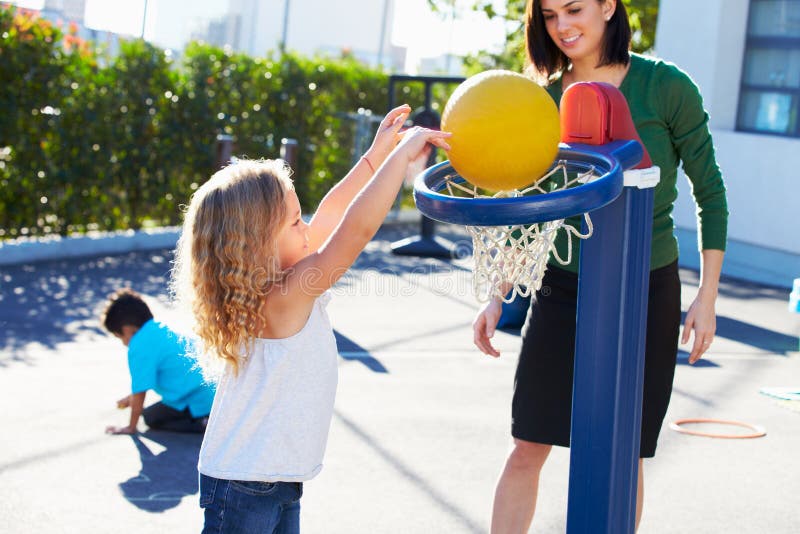 Teacher Supervising Breaktime at Elementary School Stock Photo - Image ...