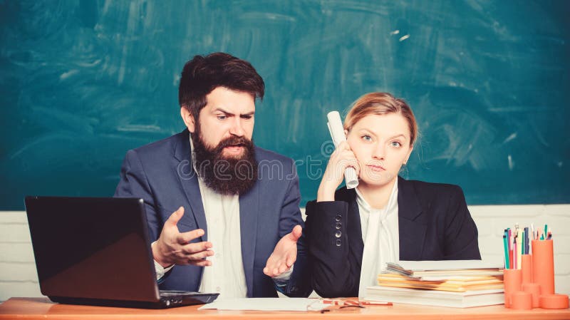 Teacher and Supervisor Working in School Classroom. School Educator and ...