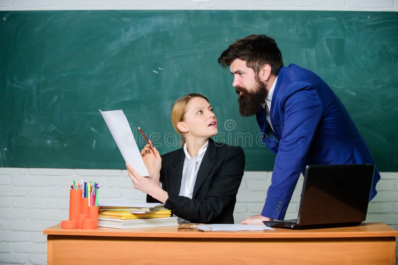 Teacher and Supervisor Working Together in School Classroom ...