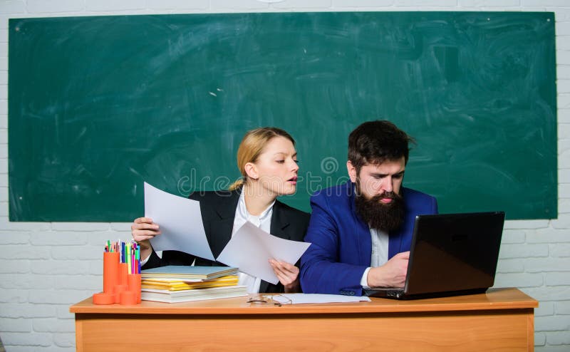 Teacher and Supervisor Working Together in School Classroom. School ...