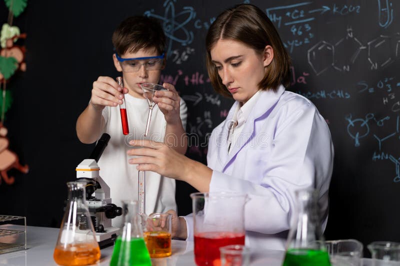 Teacher Support Schoolboy Mixing Solution in Laboratory STEM Class ...