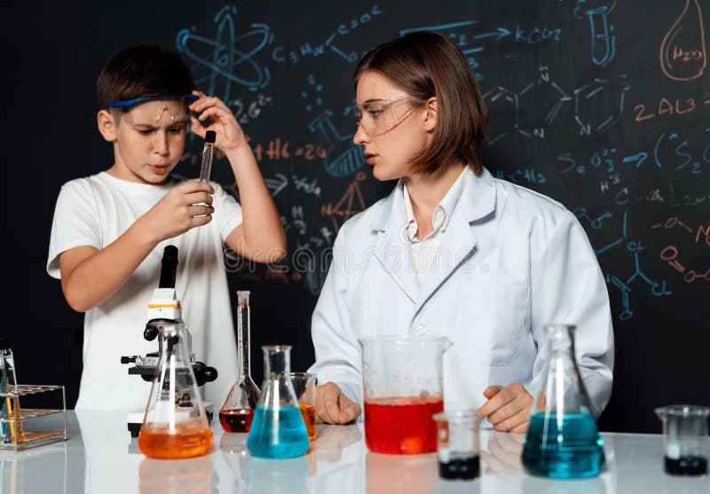 Teacher Support Schoolboy Mixing Solution in Laboratory STEM Class ...