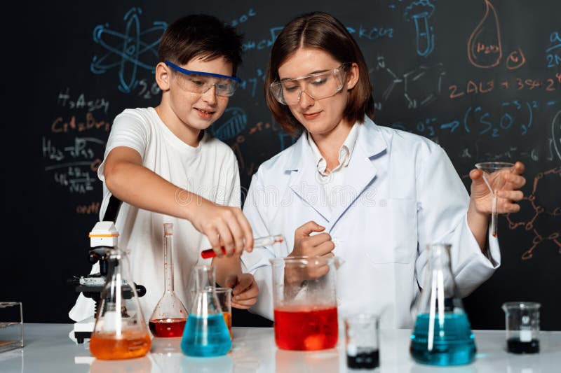 Teacher Support Schoolboy Mixing Solution in Laboratory STEM Class ...
