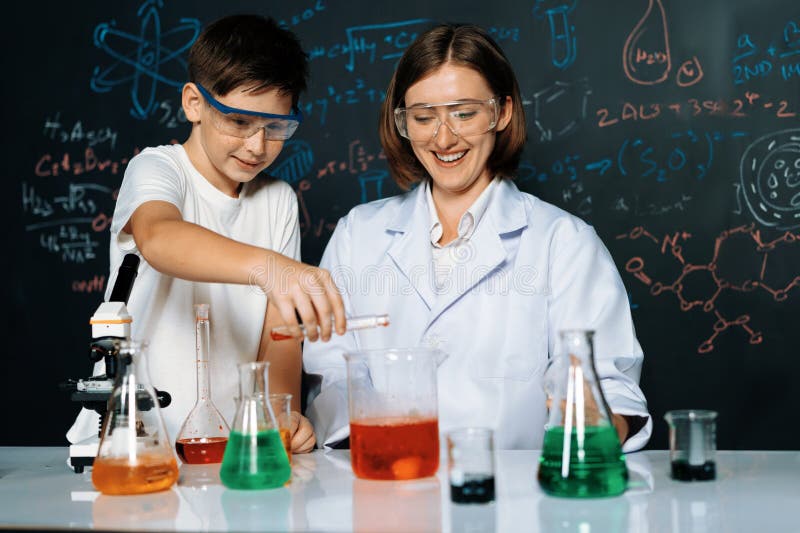 Teacher Support Schoolboy Mixing Solution in Laboratory STEM Class ...