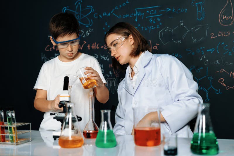 Teacher Support Schoolboy Mixing Solution in Laboratory STEM Class ...
