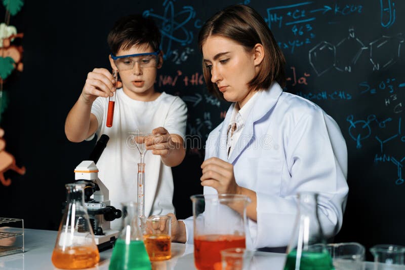 Teacher Support Schoolboy Mixing Solution in Laboratory STEM Class ...
