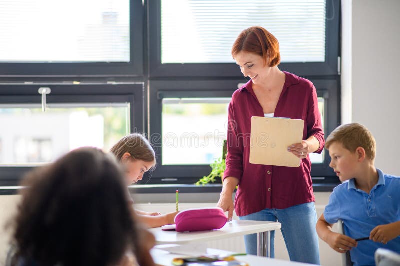 Teacher Talking with Children in Primary Class. Stock Photo - Image of ...