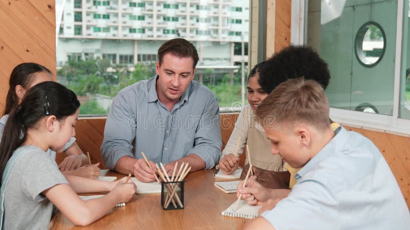 Teacher Talking and Explain Work while Children Drawing in Paper ...