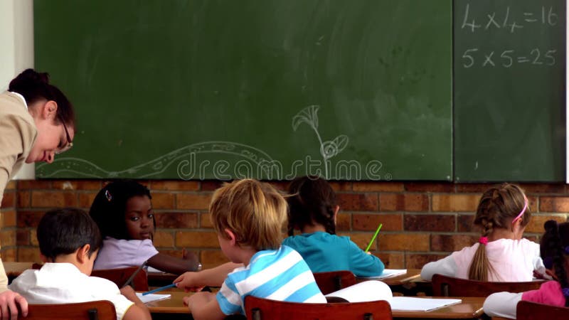 Teacher Talking with Her Young Pupils in Classroom Stock Footage ...