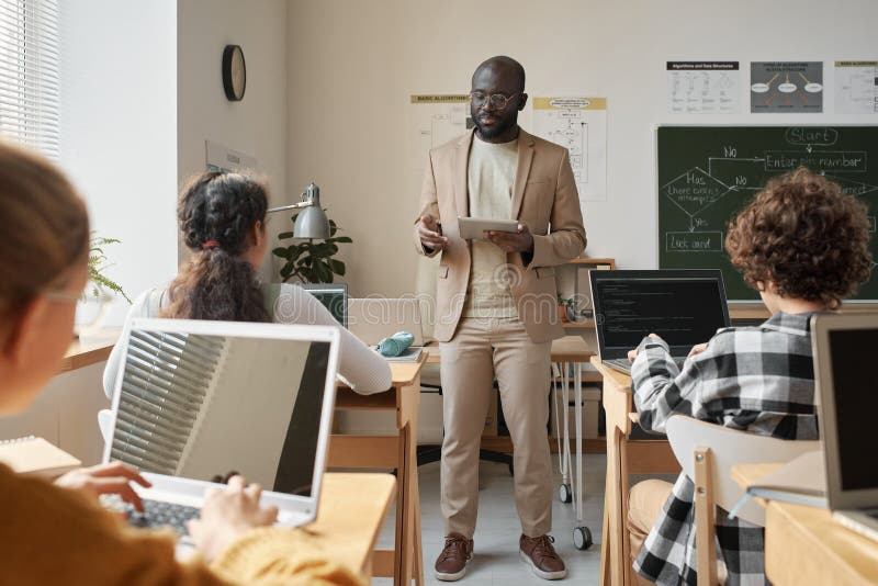Teacher Talking To Children at Lesson Stock Photo - Image of indoors ...