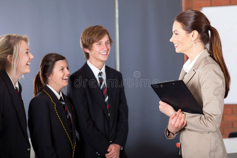 Teacher Talking To Students Stock Image - Image of smiling, beautiful ...