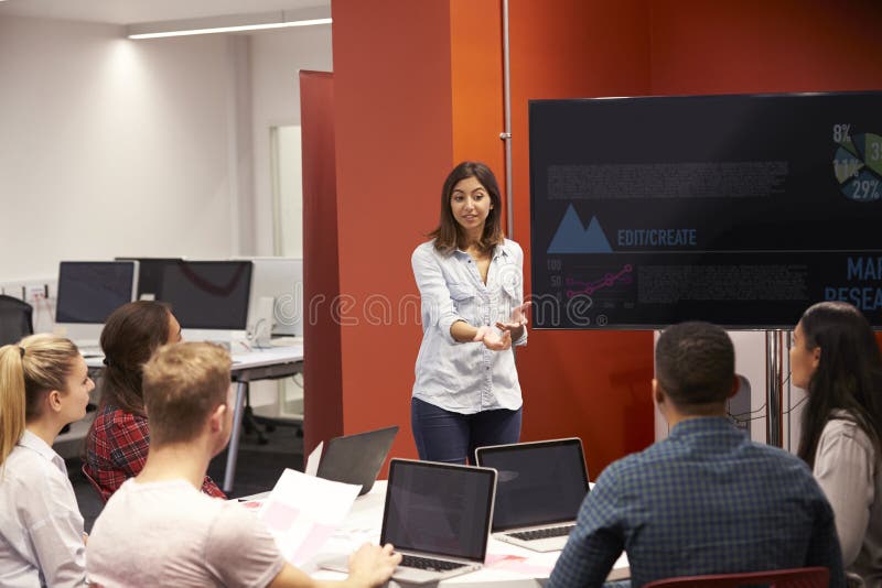 Teacher Talking To Elementary Pupils in Classroom Stock Image - Image ...